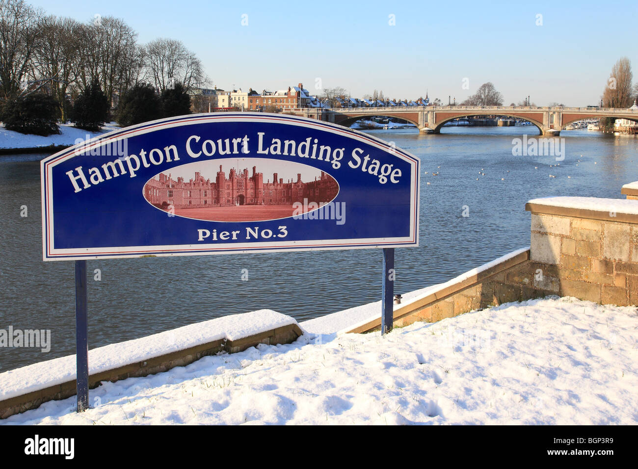 Hampton Court Palace boat landing and river Thames in winter in snow ...