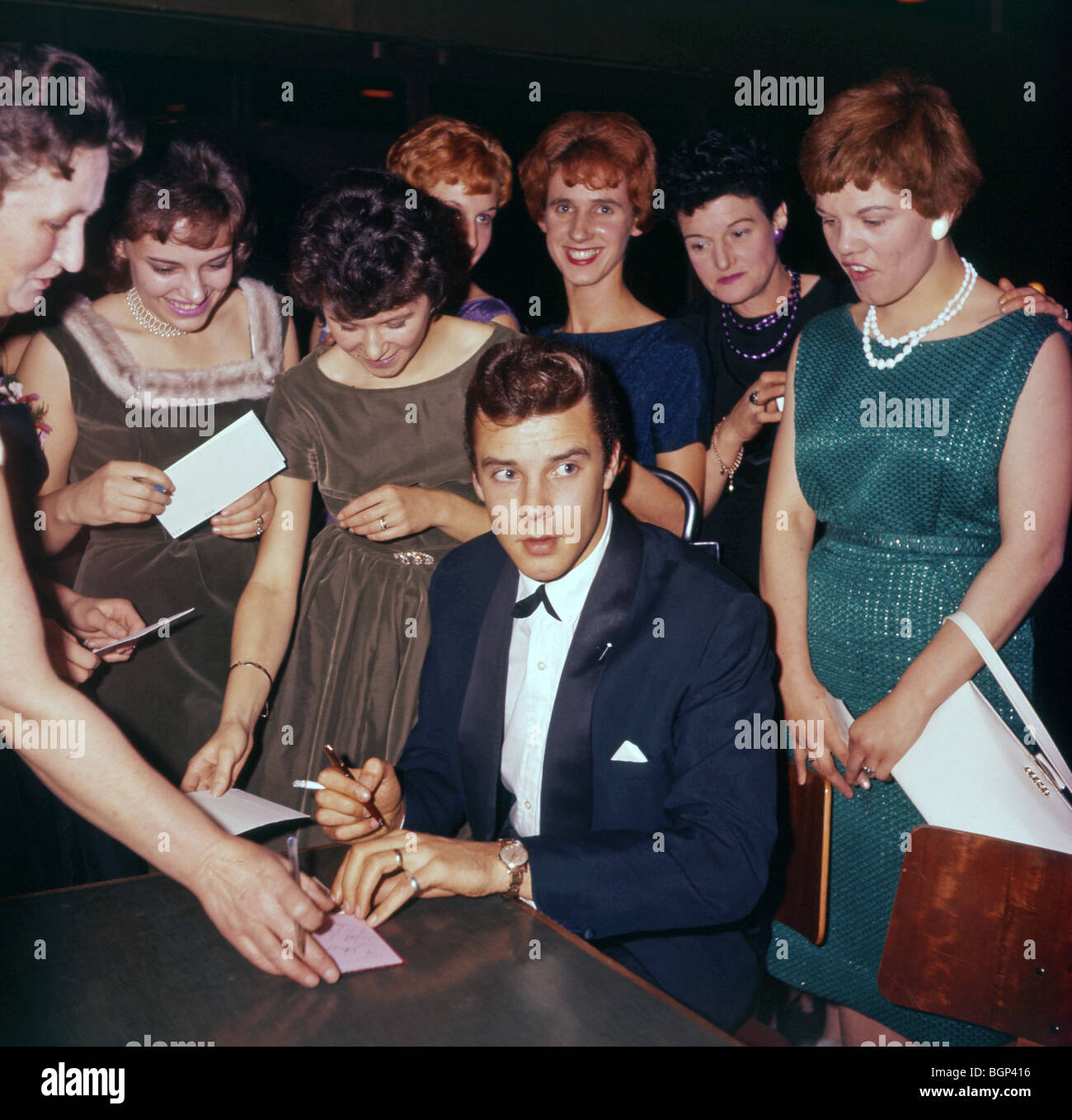 Signing autographs singer hi-res stock photography and images - Alamy