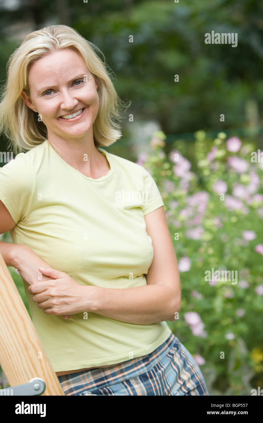 Portrait of a mid adult woman smiling Stock Photo - Alamy