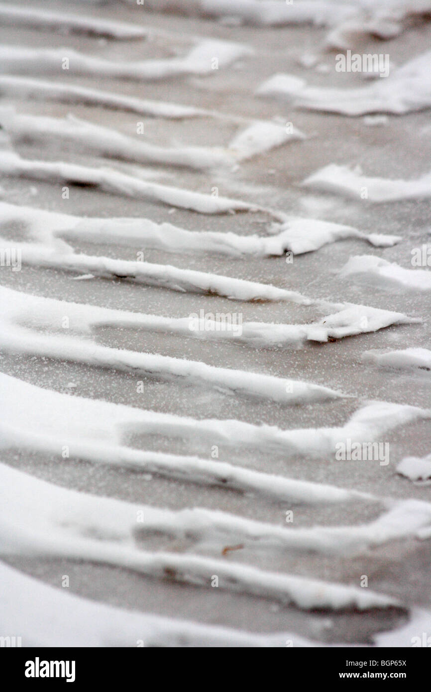 Tractor tracks in the snow and ice Stock Photo - Alamy