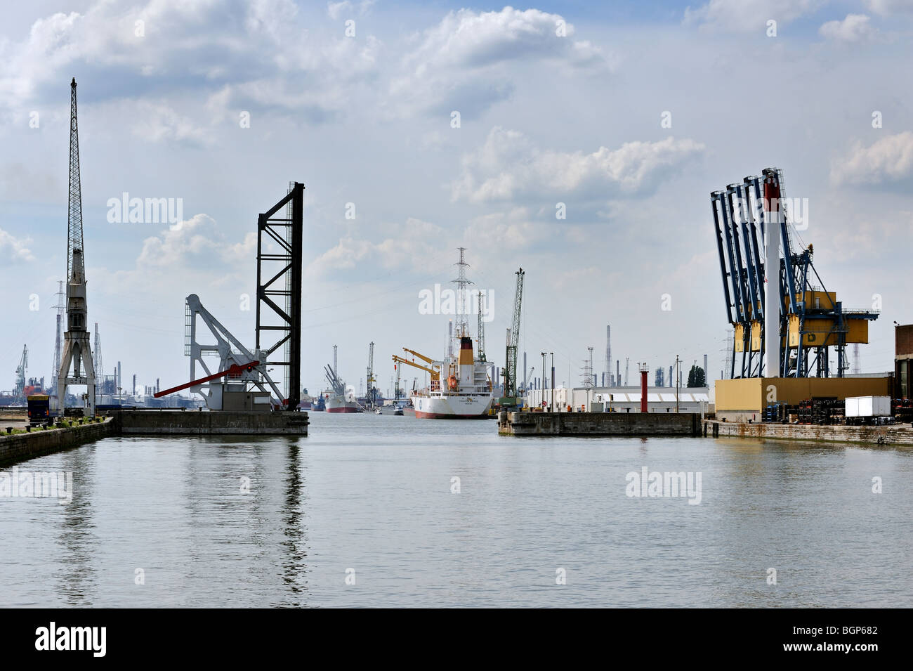 Open bridge, cranes and ships in the docks of the Antwerp harbour ...