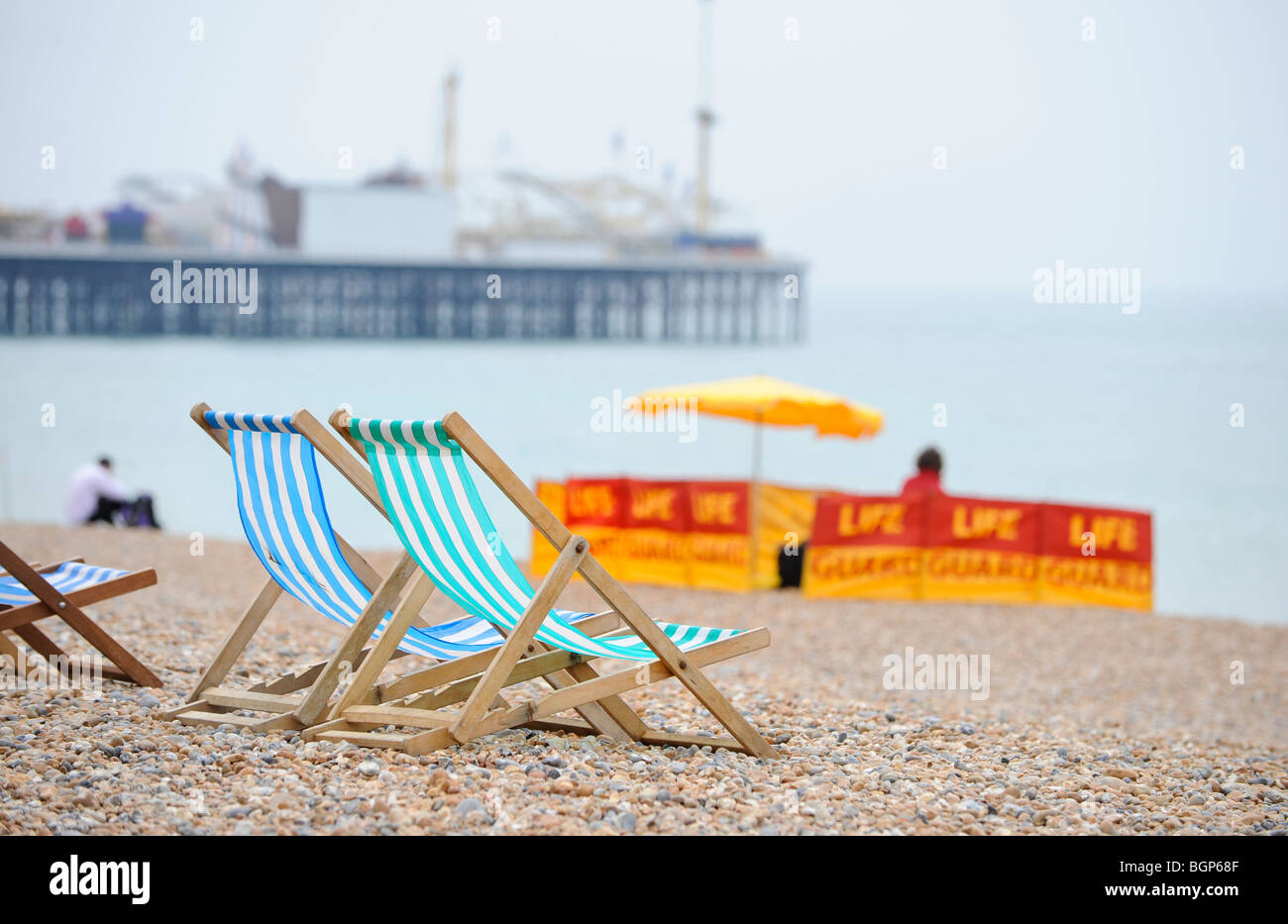Beach safety on Brighton beach in East Sussex. Deck chairs on the beach ...