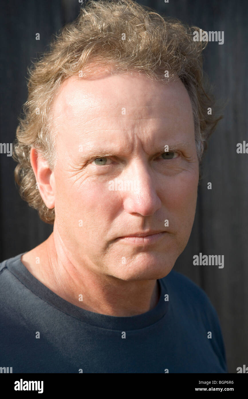 Portrait of a mature man looking serious Stock Photo - Alamy