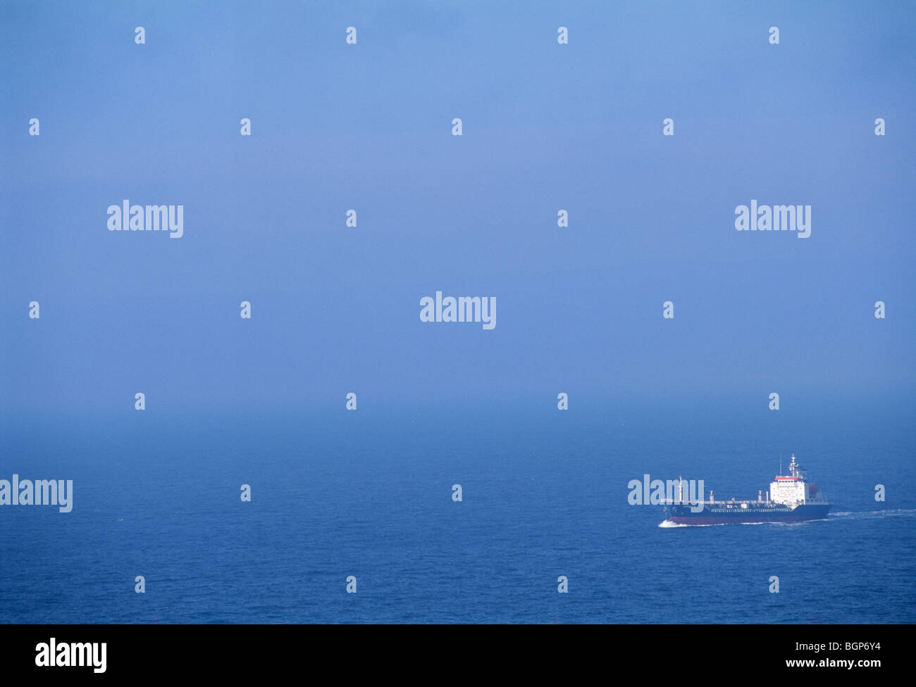 A cargo-ship in the blue sea Stock Photo - Alamy