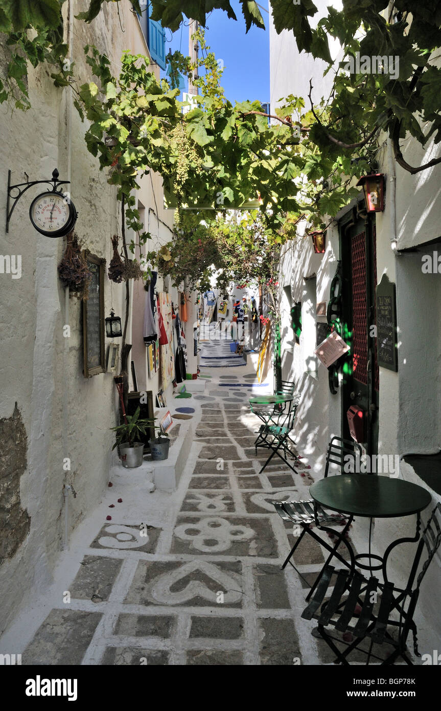 Narrow alley with shops and bars at Chora (main town), Ios island ...