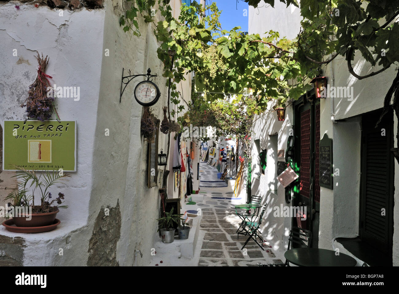 Narrow alley with shops and bars at Chora (main town), Ios island ...