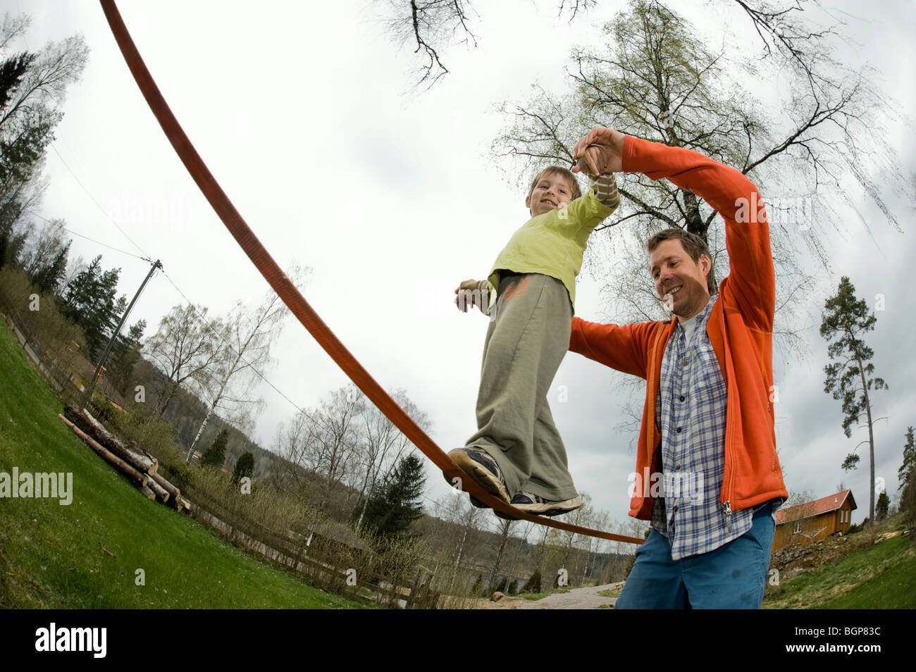 A little boy balancing on a cord Stock Photo - Alamy