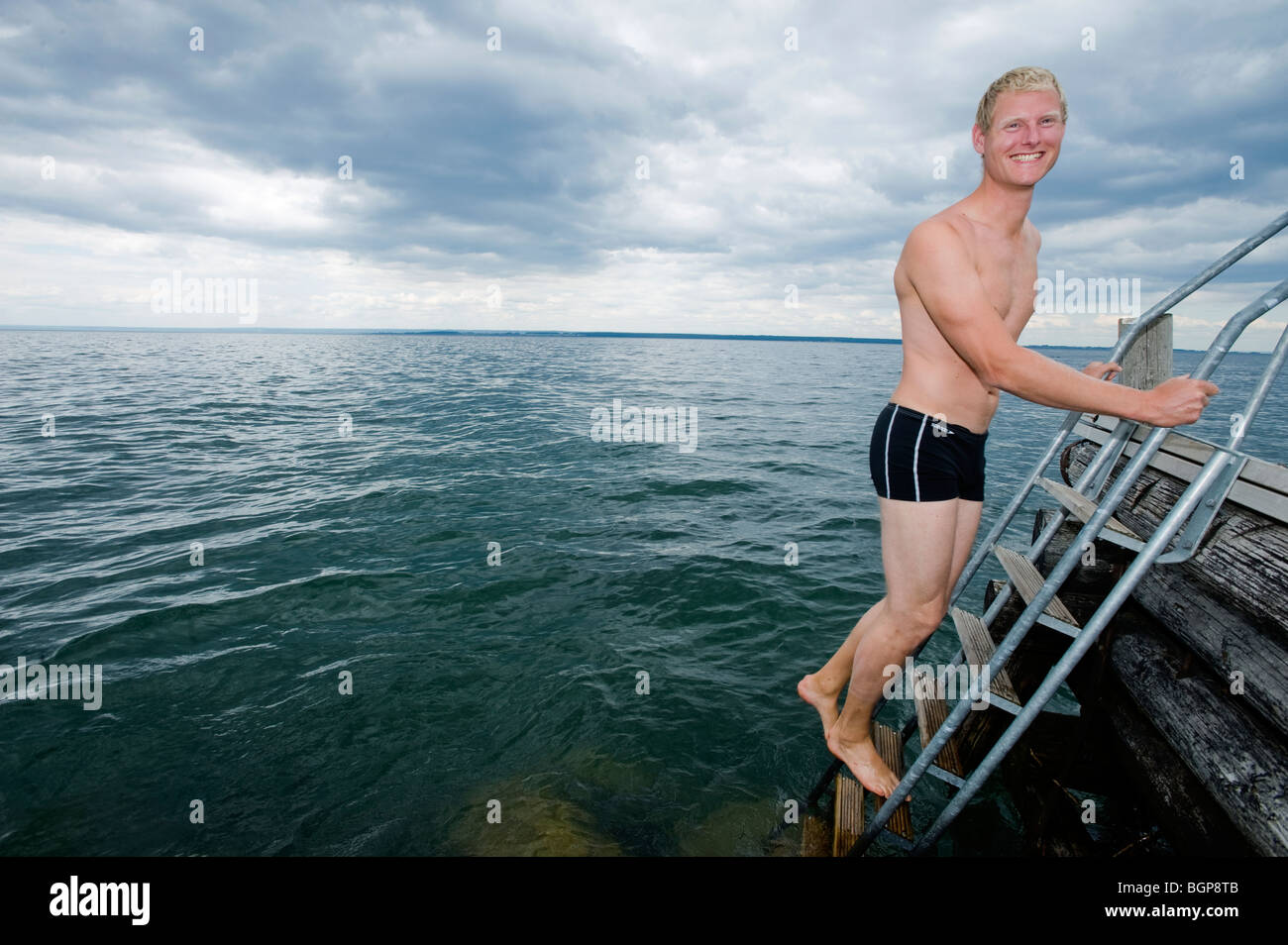 A man ready to take a swim, Sweden Stock Photo - Alamy