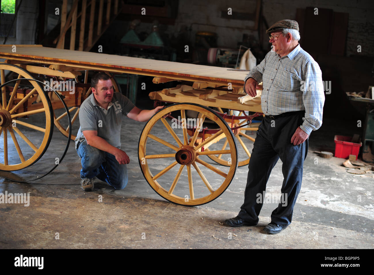 Two wheelwrights at Mike Rowland Wheelwright and coachbuilders, in ...