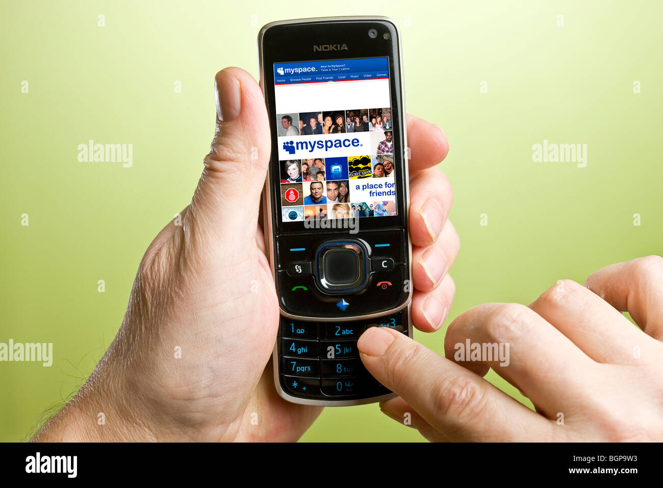 Using Myspace on a mobile phone Stock Photo - Alamy