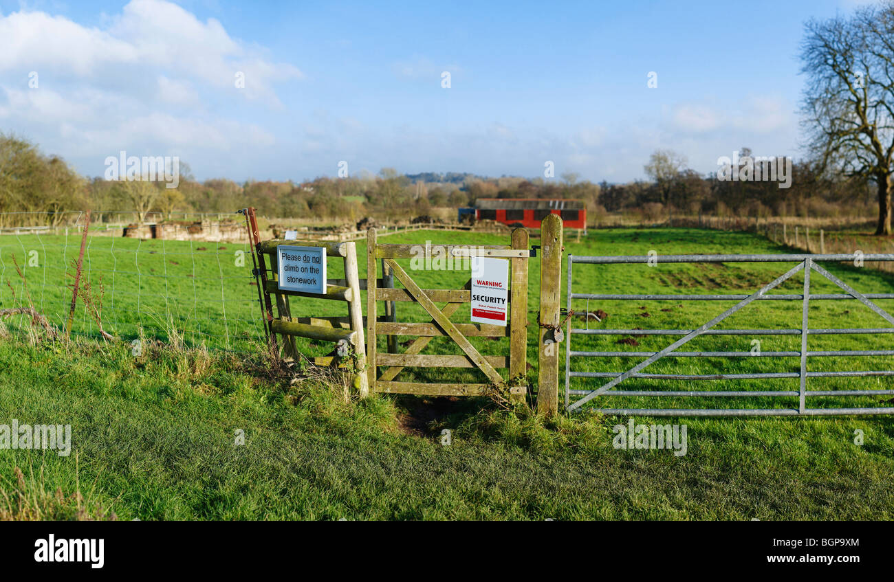 an old fence on a farm with a keep out sign Stock Photo - Alamy
