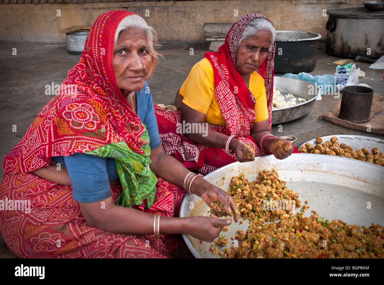 Jaipur women preparing a chickpea meal in a Hindu temple, Jaipur, India ...