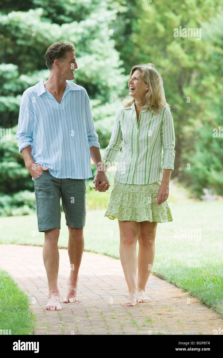 Couple with a baby walking hi-res stock photography and images - Alamy