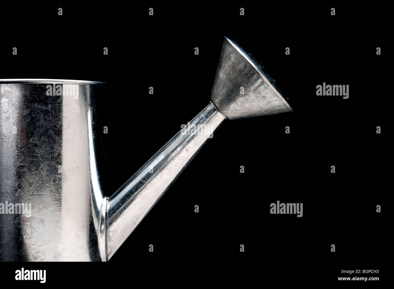 Horizontal close up of a metal watering can on black Stock Photo - Alamy