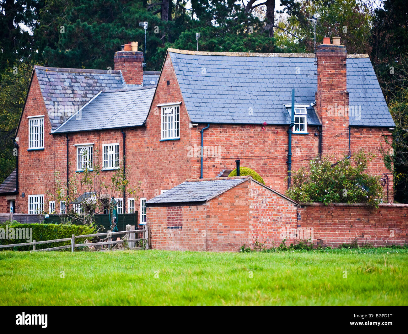 a red brick house in the countryside Stock Photo - Alamy