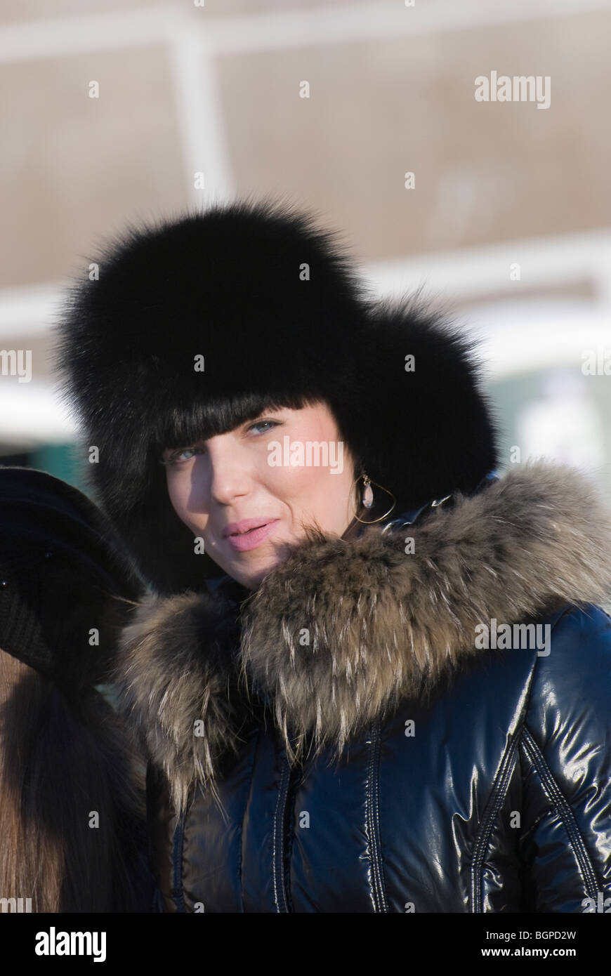 A nice Russian young woman in black fur cap Stock Photo - Alamy