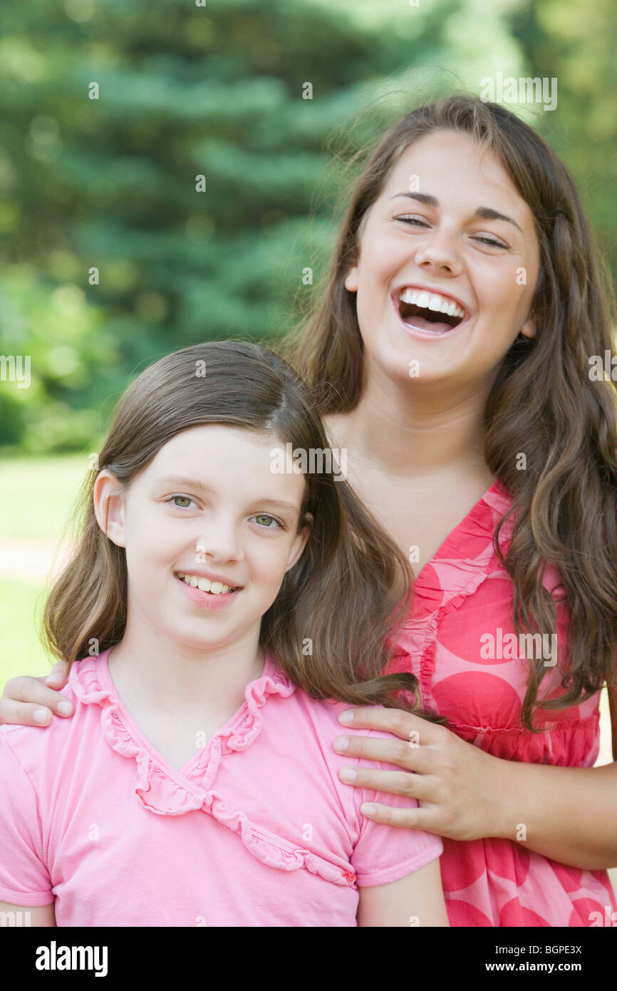 Close-up of two sisters smiling Stock Photo - Alamy