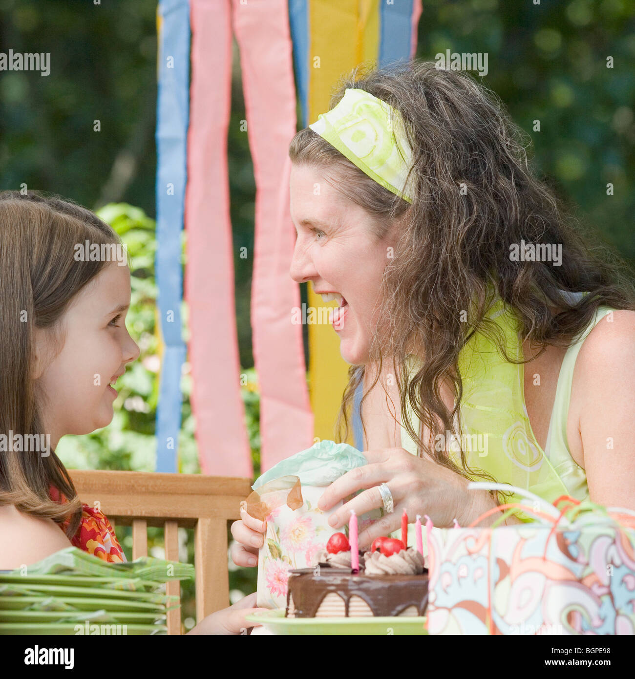 Girl giving a gift to her mother on her birthday Stock Photo - Alamy