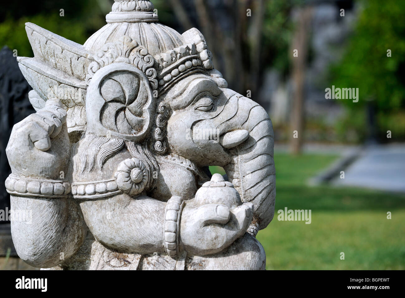 Indian Ganesha statue, showing the head of an elephant and the body of ...