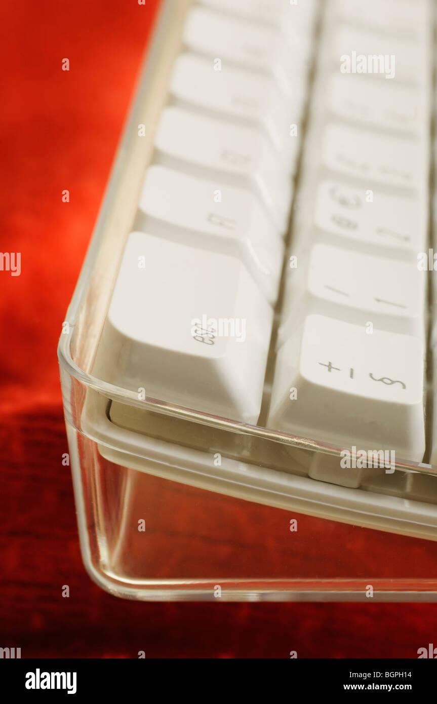Computer keyboard on red background Stock Photo - Alamy