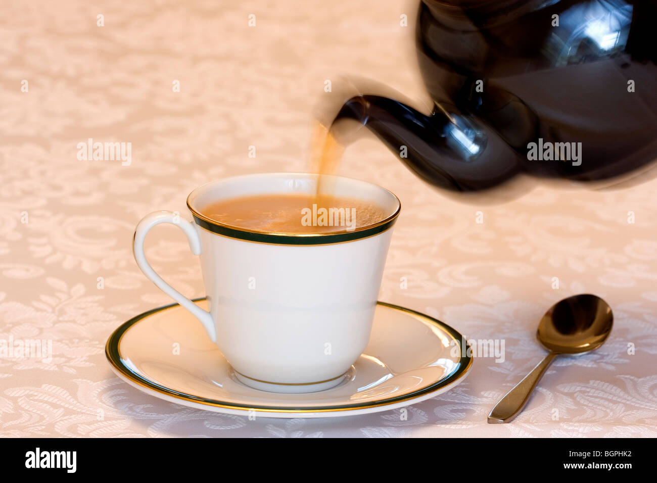 Tea Being Poured Into A Tea Cup Stock Photos & Tea Being Poured Into A ...