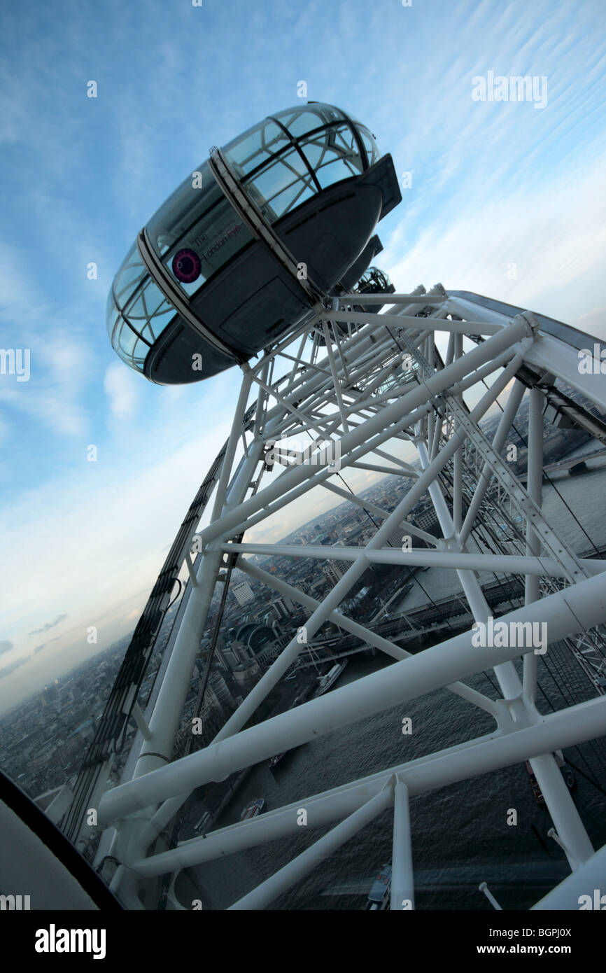 A london eye pod slowly rotates into the december sunset Stock Photo ...