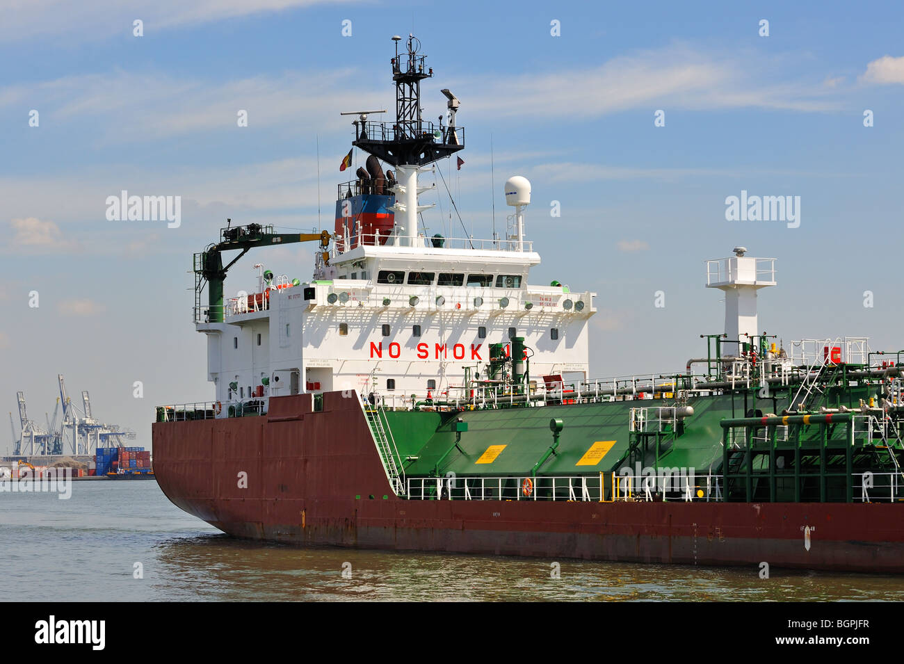 Red gas tanker sailing into dock of the Antwerp harbour, Belgium Stock ...