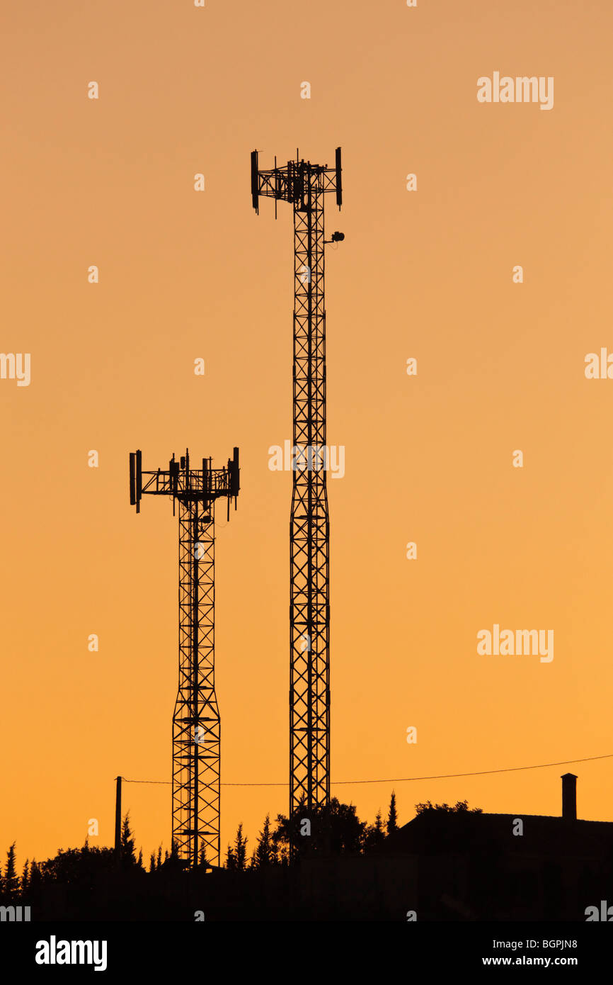 Silhouette of cell phone masts Stock Photo - Alamy