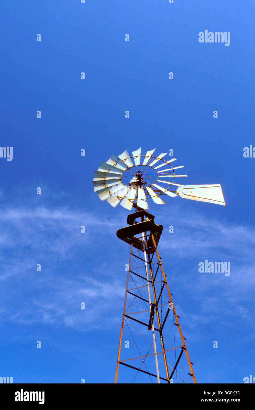 Antique Aermotor Farm style windmill for pumping water sits against a ...