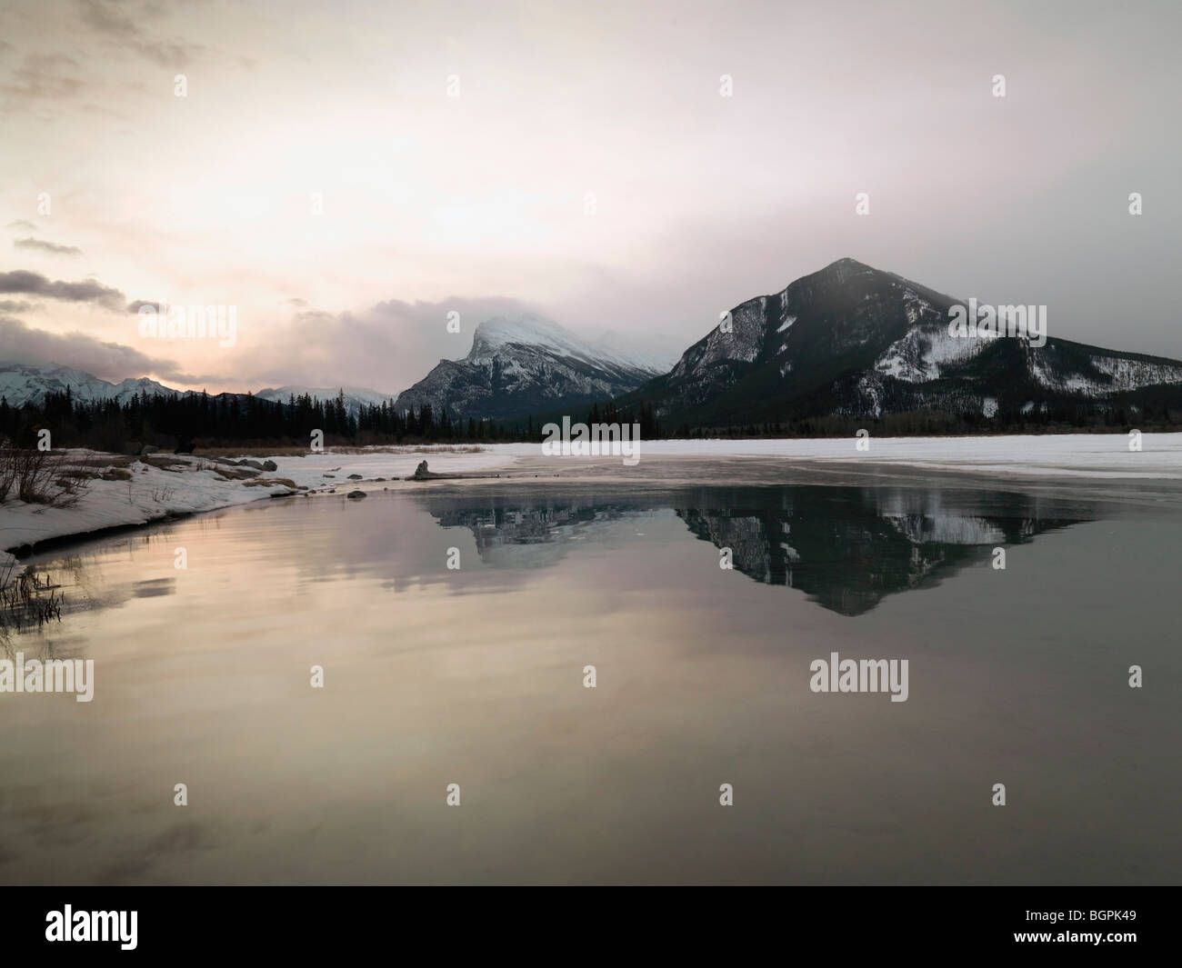 Mountains reflecting in water; Banff, Alberta, Canada Stock Photo - Alamy