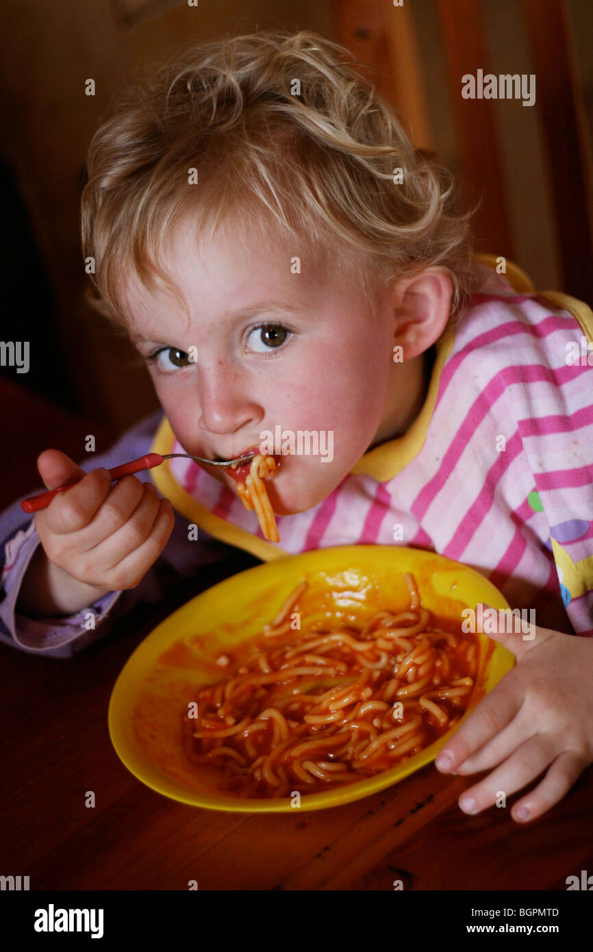 Baby girl eating spaghetti hi-res stock photography and images - Alamy