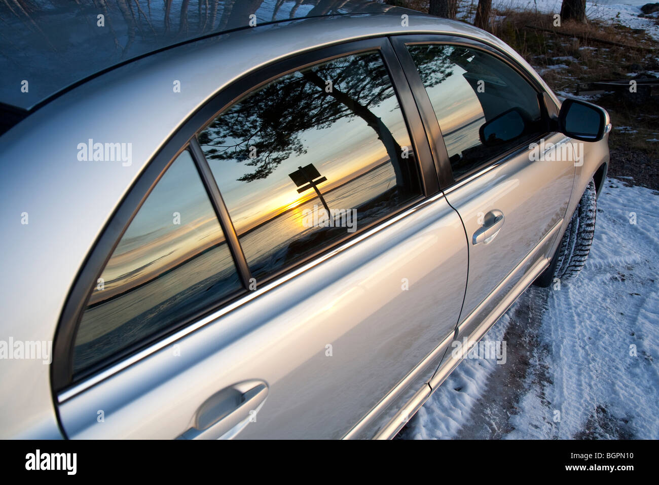 Reflection of a lake view at sunset on the car window , Finland Stock ...