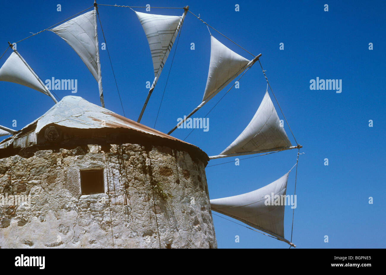 Traditional wind power with a windmill grinding corn on a Greek island ...