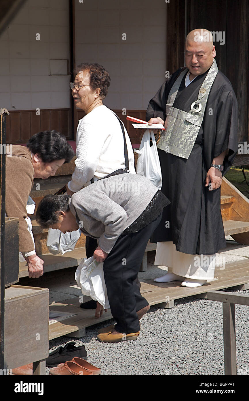 Japanese priest and Temple visitors, Kyushu, Japan Stock Photo - Alamy
