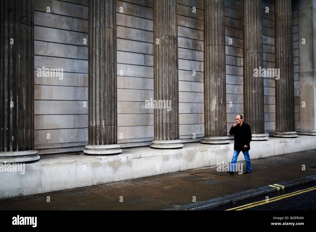 Man walking along the Bank of England London, Britain, UK Stock Photo ...