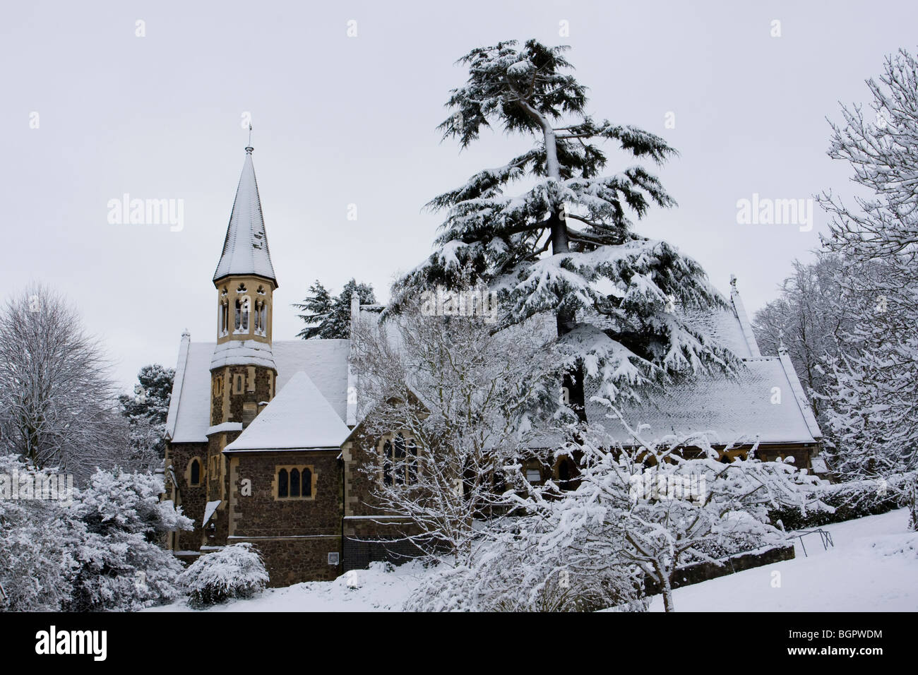 White snow covered St James Holy Trinity Parish Church, West Malvern ...