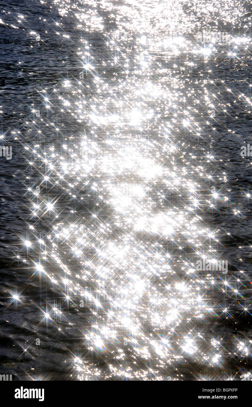 Sun reflection on water Stock Photo - Alamy