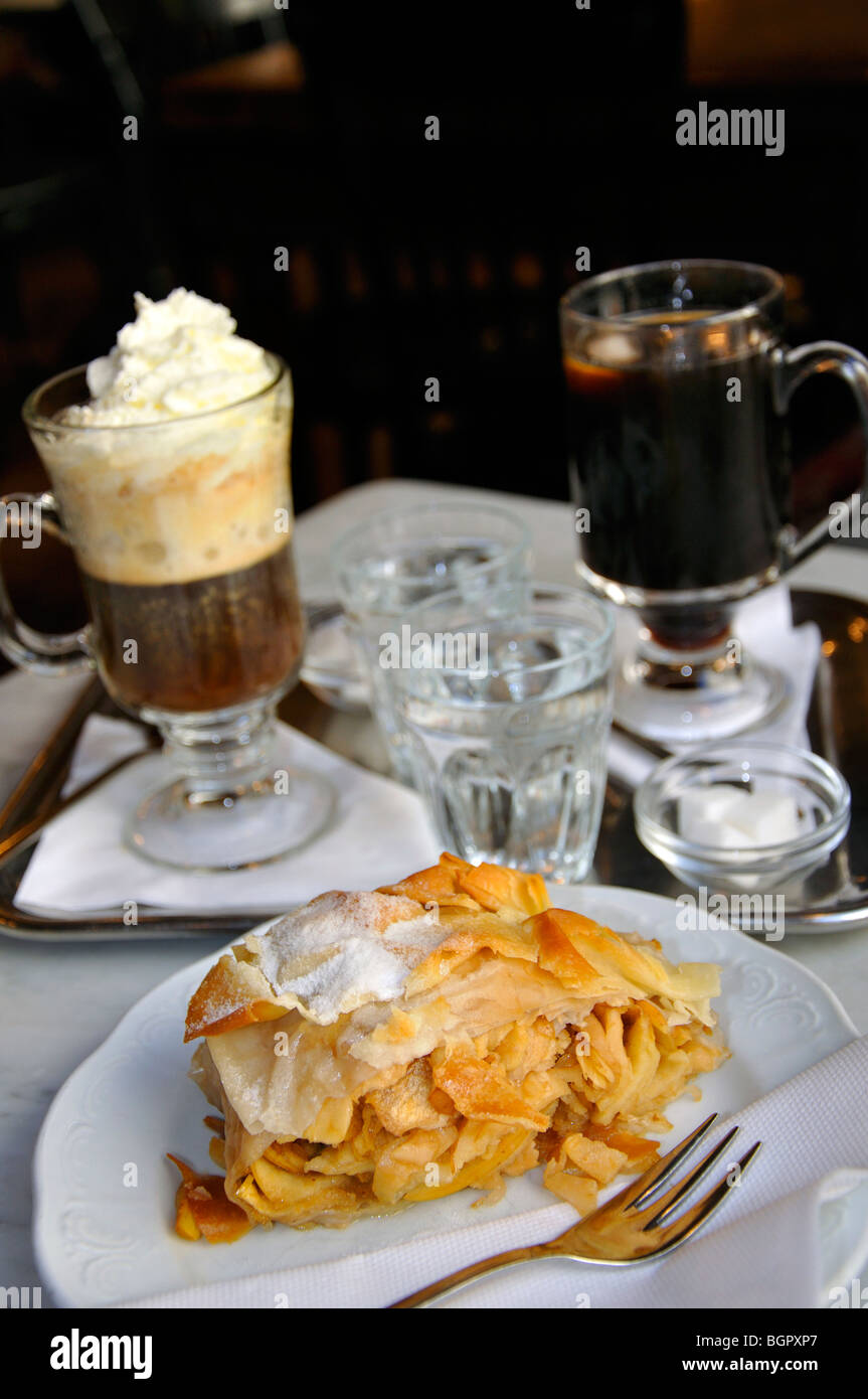 Coffee with whipped cream and apple strudel Stock Photo - Alamy