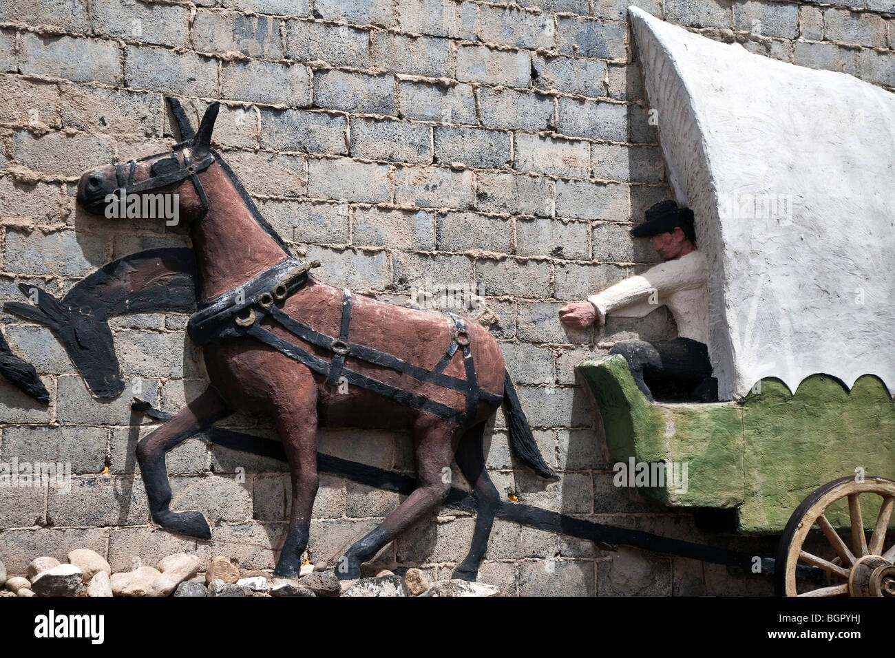 Artwork old western mule and wagon in street of San Luis, Colorado, USA ...