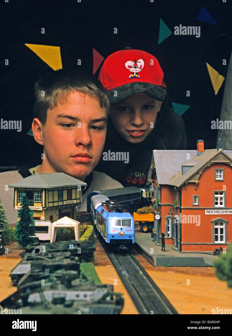 two brothers playing with their train set Stock Photo - Alamy