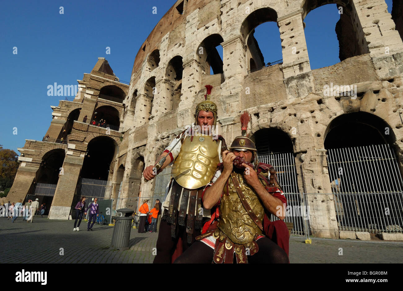Actors dressed as Roman soldiers posing for tourists in front of ...