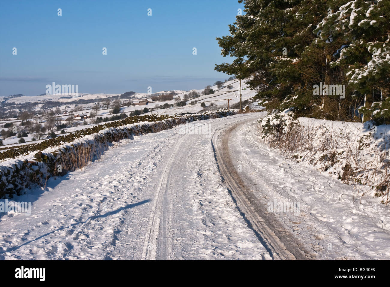 Snow covered road Stock Photo - Alamy