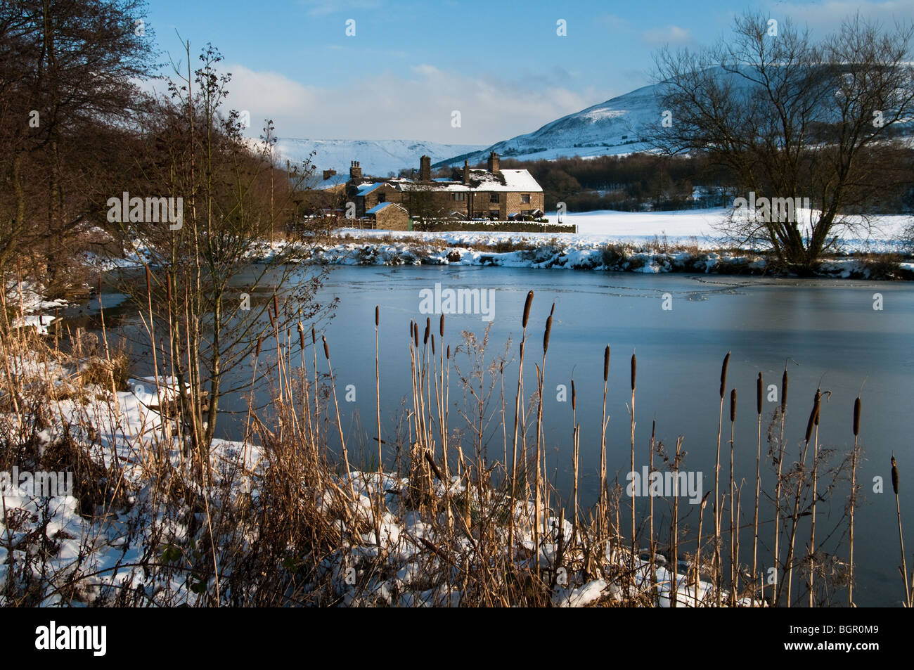 Cottages and pond at The Manns, Greenfield Stock Photo - Alamy