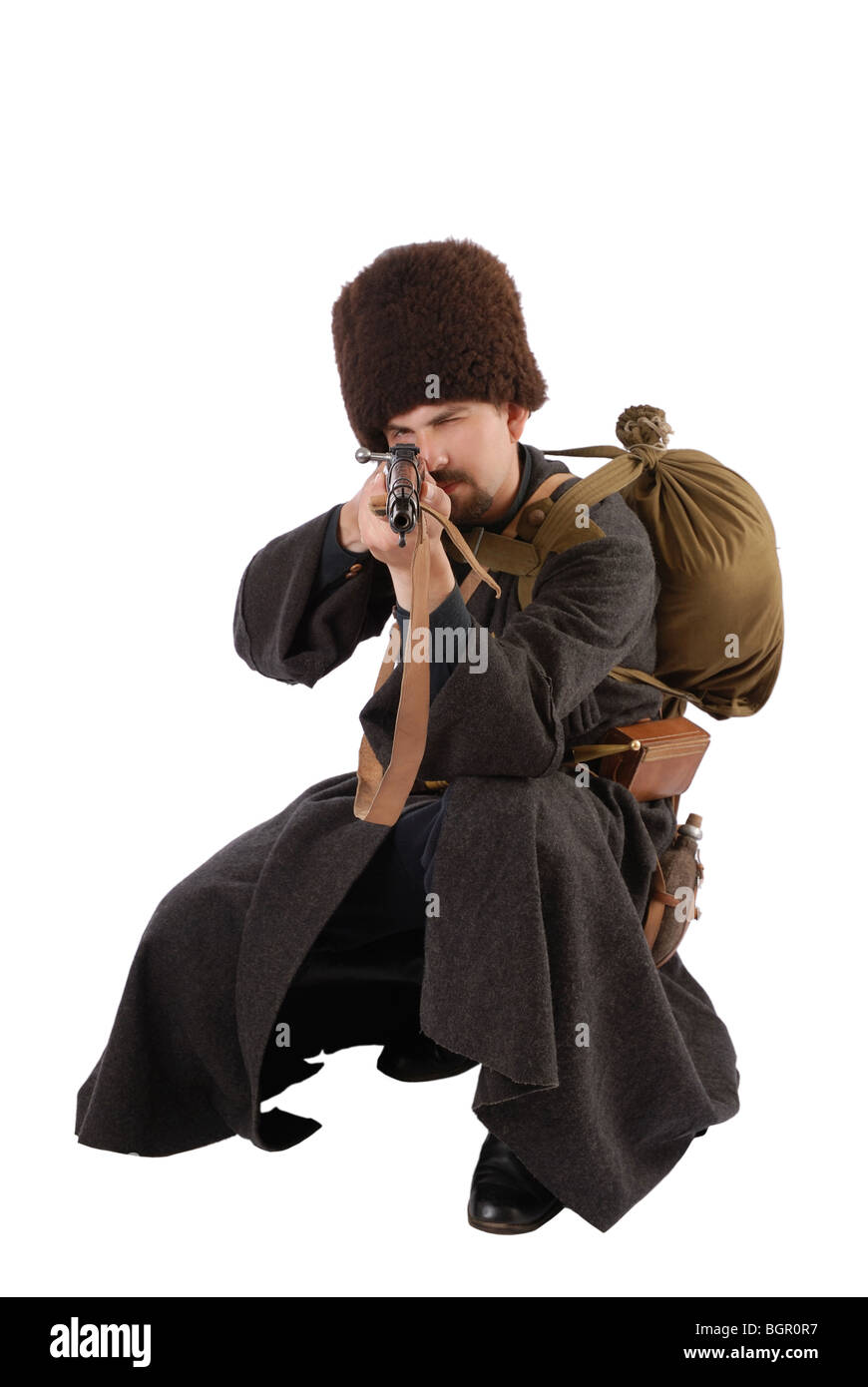 Russian Cossack points a rifle at camera in squatting position Stock ...