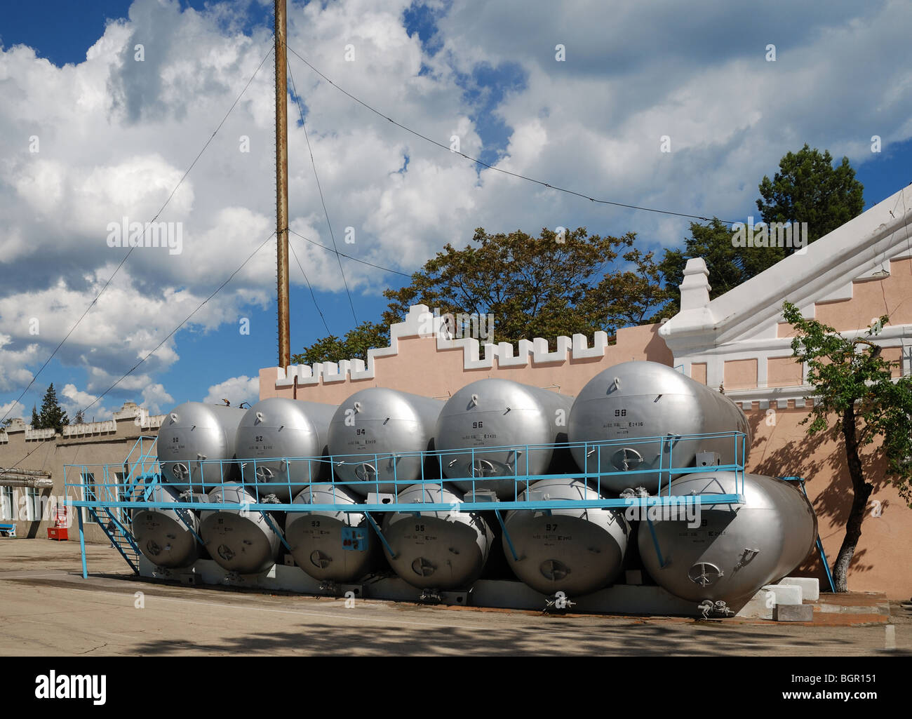 Large steel vats are glittering in sunlit yard of modern winery Stock ...
