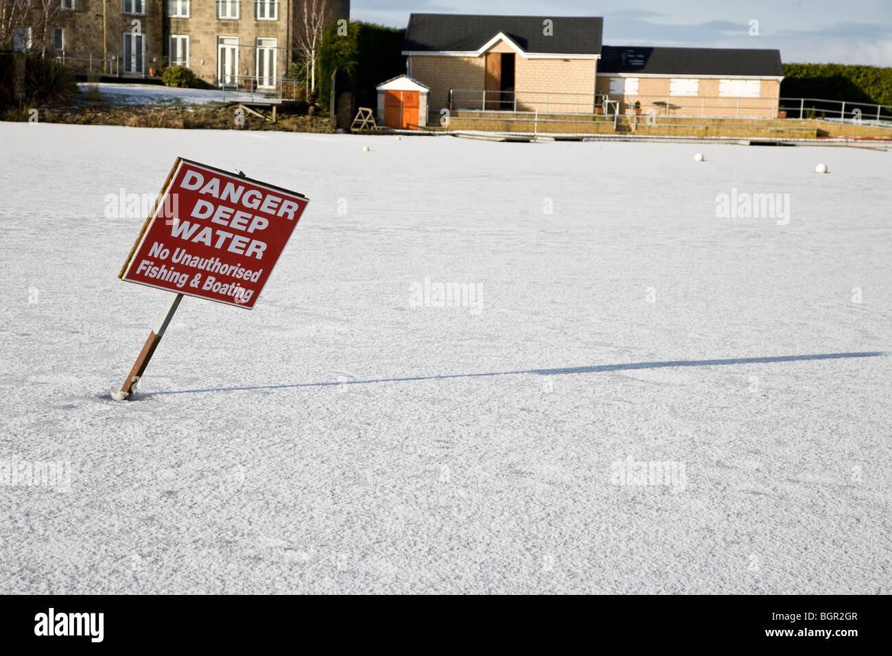 Danger, Deep Water sign on a frozen tarn Stock Photo - Alamy