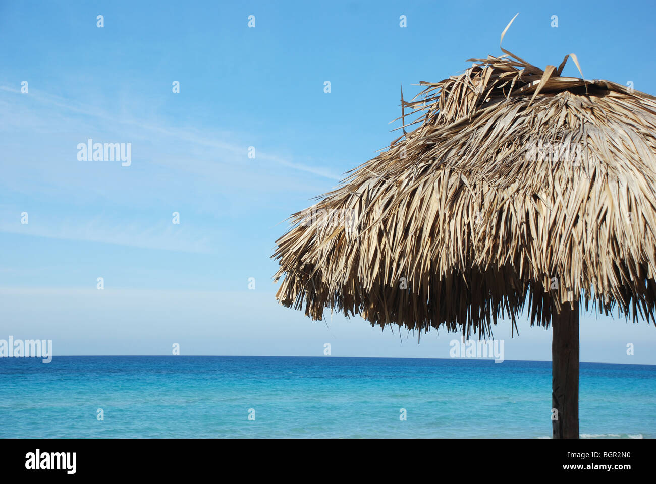 Beach straw umbrella Stock Photo - Alamy