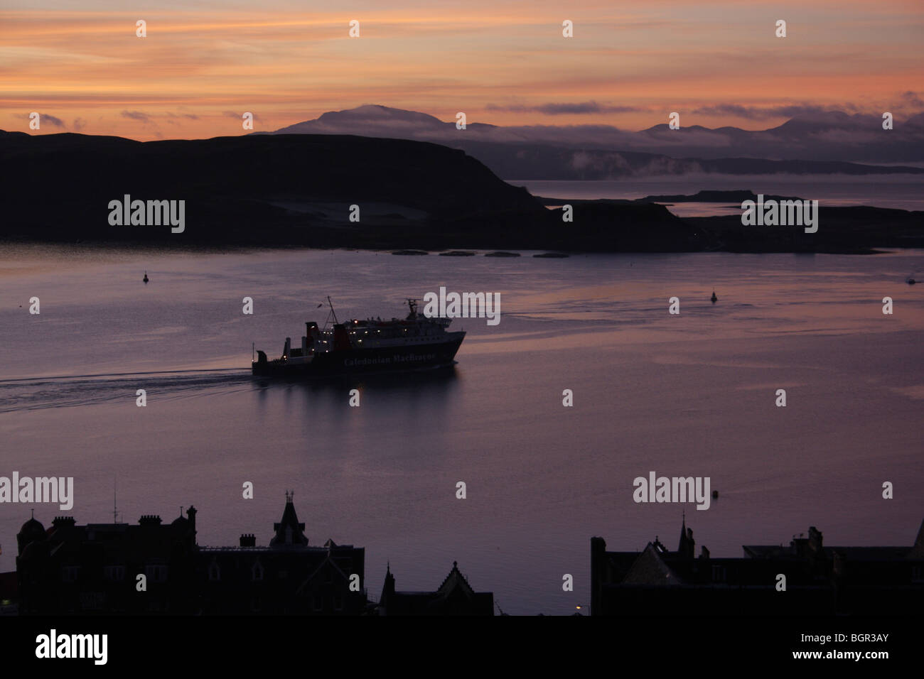 Ferry to the Western Isles leaving Oban (Argyll, Scotland) at sunset ...