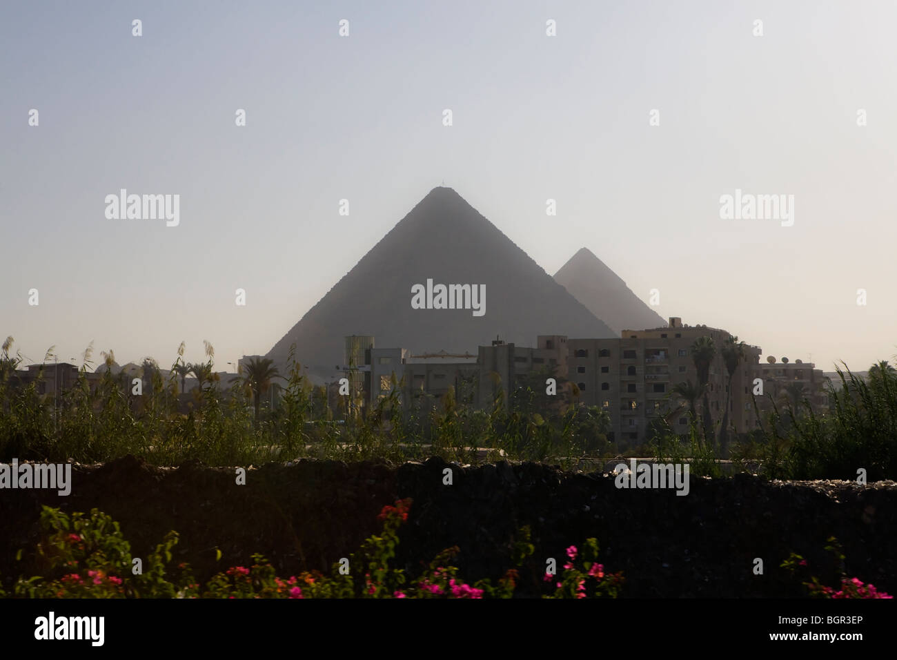 Shot of the Great Pyramids of Giza taken from street in modern Cairo ...