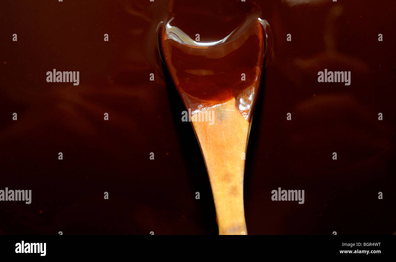 Melted chocolate with mixing spoon Stock Photo - Alamy